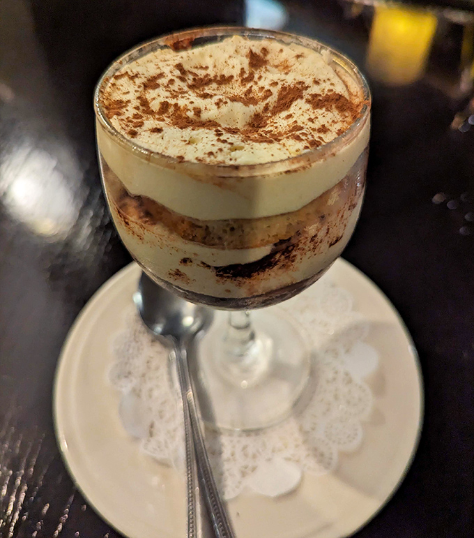 Tiramisu layered with such precision it could teach engineering classes, dusted with cocoa that whispers sweet Italian nothings to your taste buds.