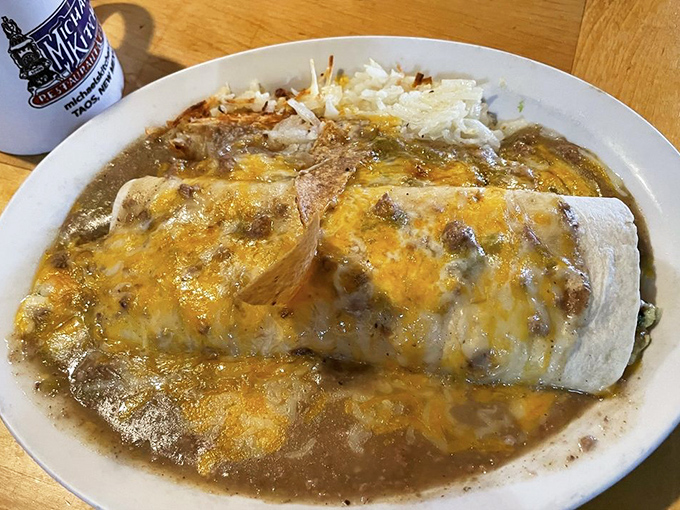This smothered burrito isn't just food &ndash; it's an edible work of art where cheese meets chile in a pool of New Mexican perfection.