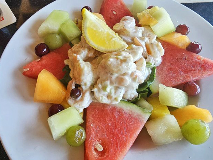 A fruit salad playing host to creamy shrimp salad&mdash;like finding an oasis in a tropical garden. Summer on a plate.