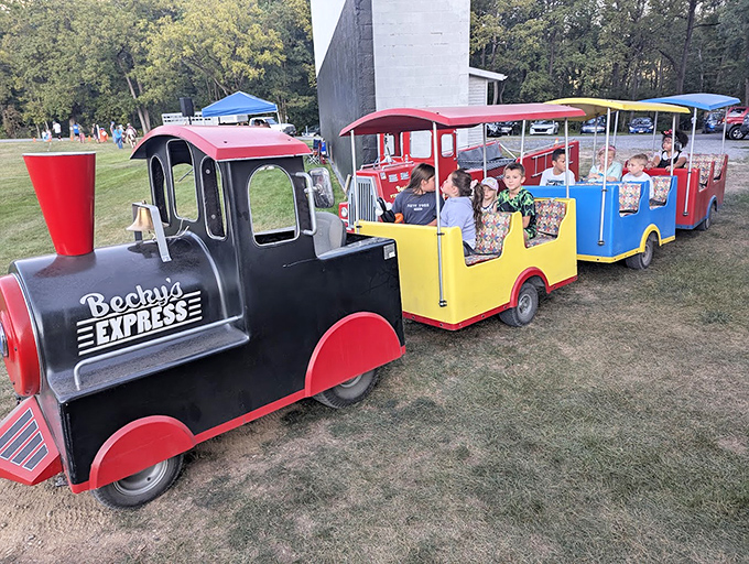 The Becky's Express chugs along with precious cargo. No tickets needed for this pre-show journey around the grounds.