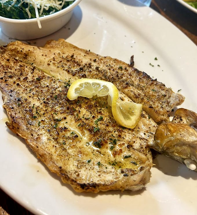 Simple perfection: a beautifully cooked fish that needs nothing more than lemon and herbs. Sometimes less truly is more.