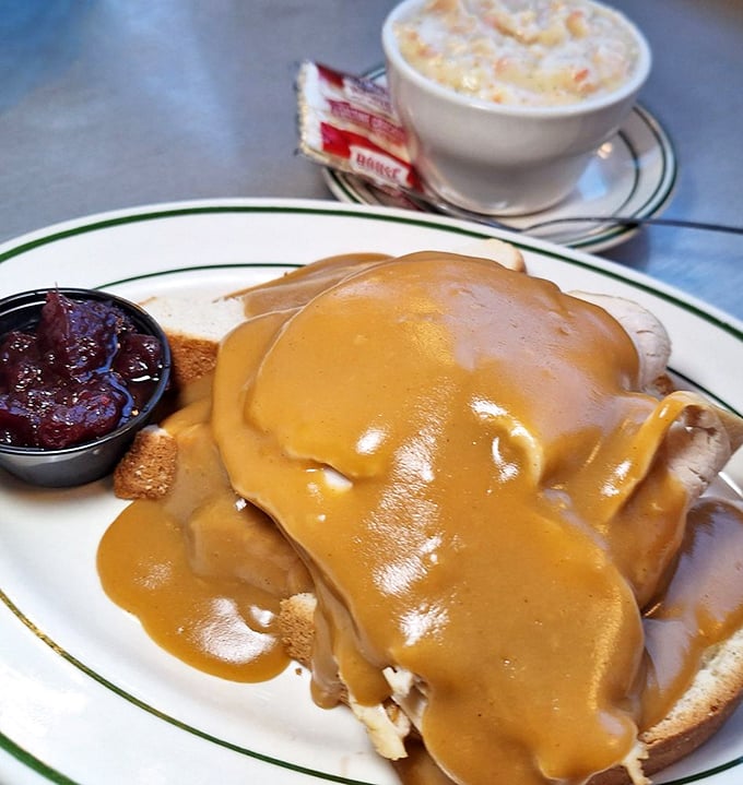 Hot turkey sandwich &ndash; where Thanksgiving comfort meets everyday indulgence. That gravy river should have its own boat tours.