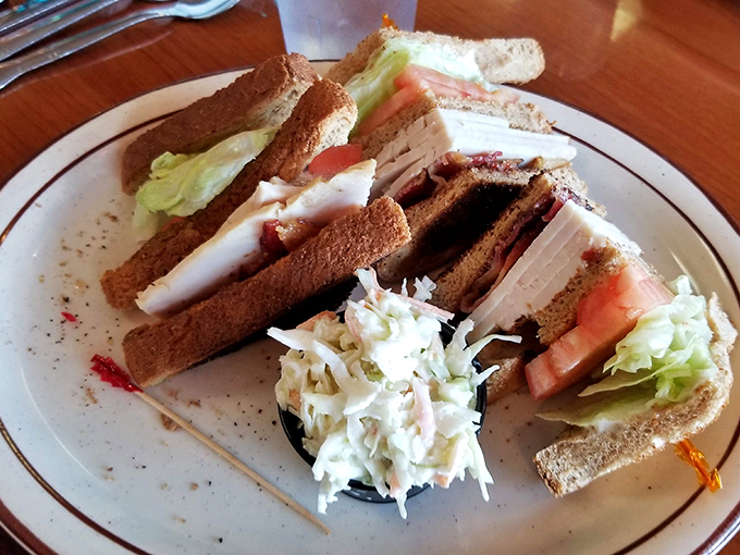 Turkey club perfection paired with coleslaw that actually enhances the meal instead of just taking up space.