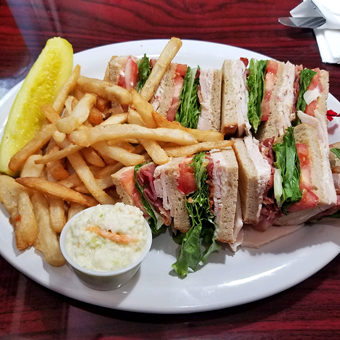 The club sandwich &ndash; architecture you can eat, where each perfectly cut triangle stands as a monument to sandwich engineering excellence.