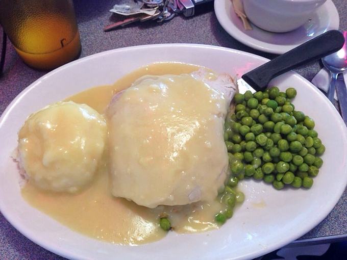 Turkey dinner that tastes like Thanksgiving without the family drama. Those peas aren't just a garnish&mdash;they're the pop of color your Instagram needs.