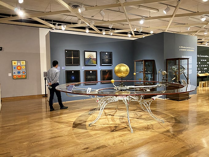 The University Museum transforms science into art, where celestial instruments become sculptural wonders under the thoughtful gaze of curious visitors.