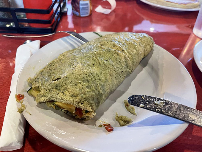 A vegetable omelet that somehow makes eating greens before noon feel like an indulgence rather than a virtue.