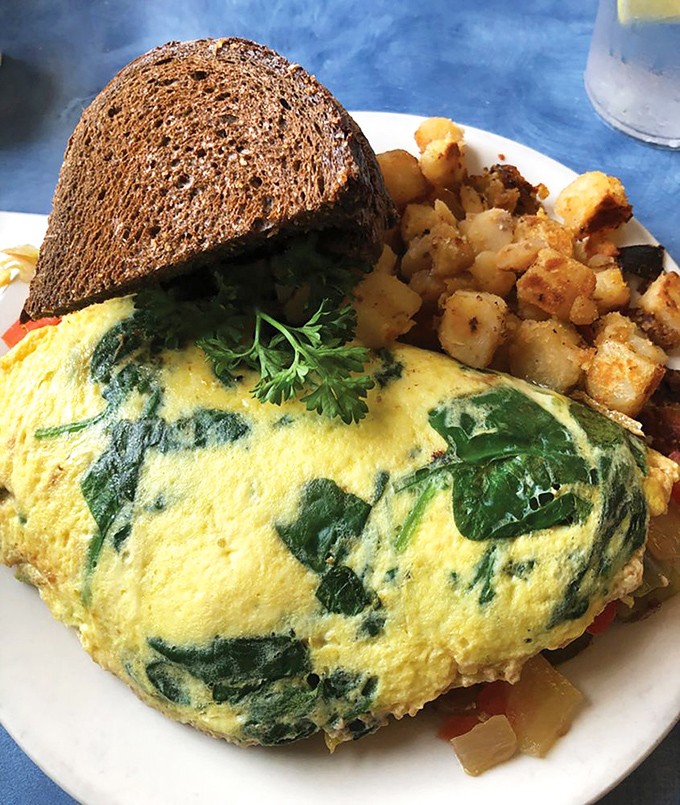 This spinach-packed omelet, fluffy and vibrant, proves that "eating your vegetables" can be the highlight of your morning rather than a chore.
