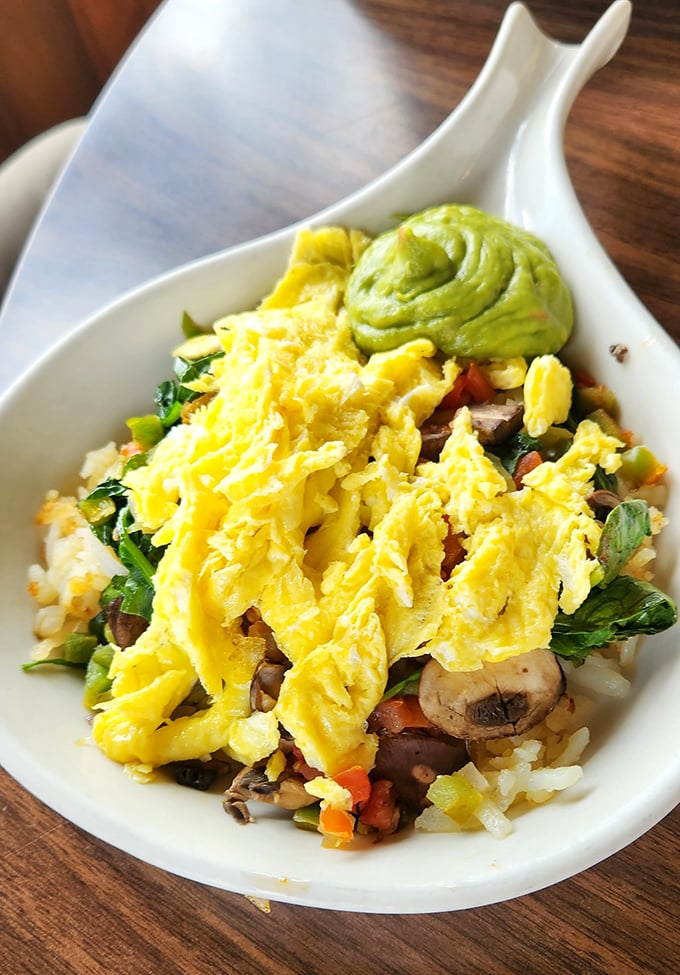 This veggie skillet is what happens when health food and comfort food call a delicious truce, topped with eggs and avocado for good measure.