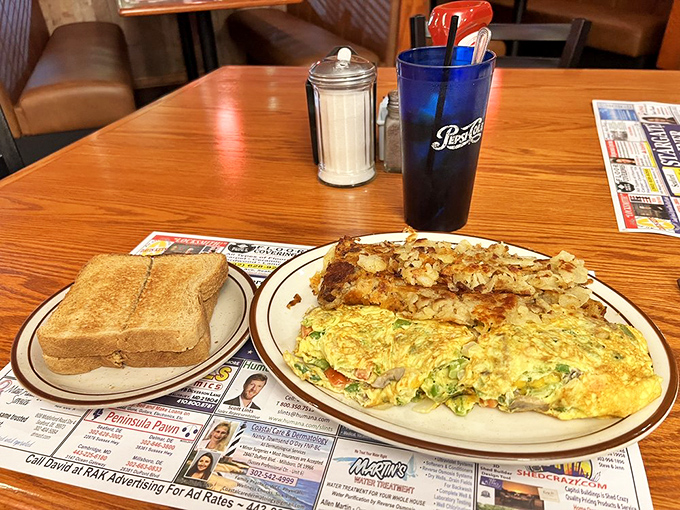 Breakfast of champions: a veggie-packed omelet alongside crispy home fries and toast&mdash;fuel for exploring Delaware's coastal treasures.