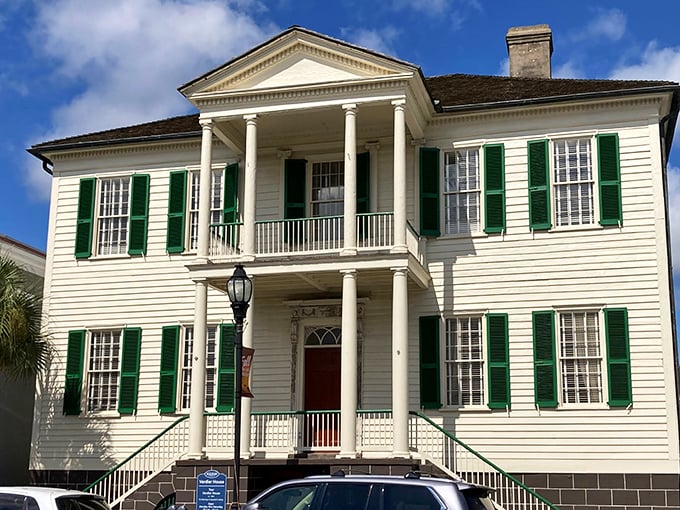 The Verdier House stands as a pristine example of Federal-style architecture. Those green shutters against white clapboard are the architectural equivalent of a perfect mint julep.