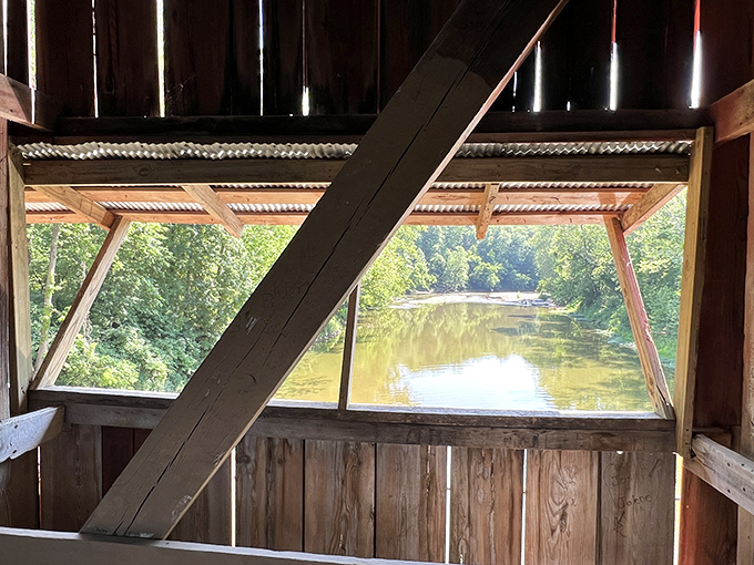 Windows to the past offer glimpses of Sugar Creek's peaceful flow. Nature's artwork framed by century-old craftsmanship.
