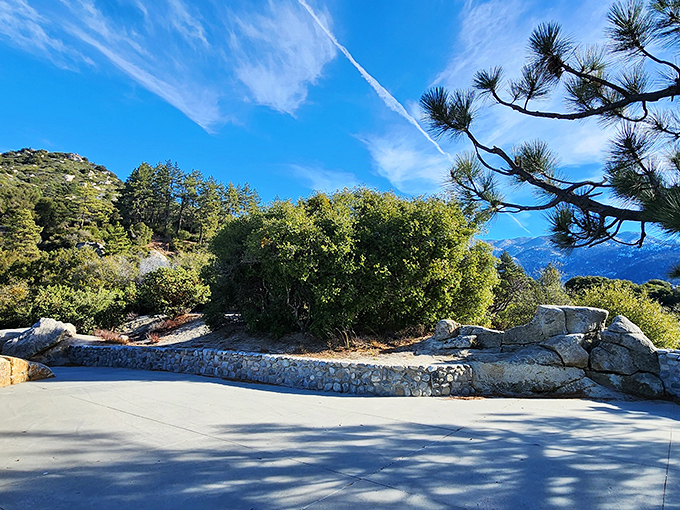 The stone wall frames the vista like a gallery masterpiece. Even Monet would put down his paintbrush and just stare in wonder.