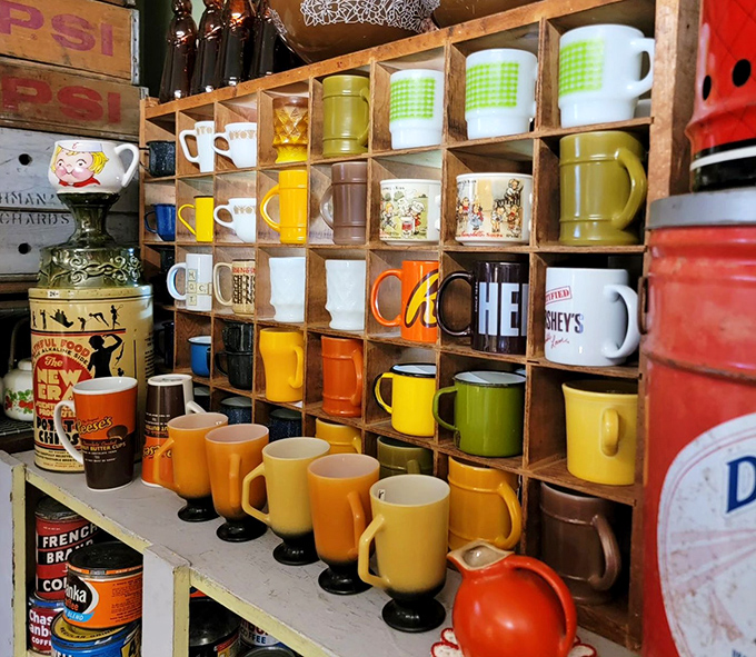 Coffee mugs from every decade line up like a liquid time machine. That Hershey's mug is practically begging to be filled with hot chocolate.