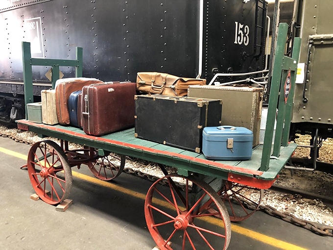 A perfectly preserved luggage cart loaded with vintage suitcases&mdash;the Instagram-worthy shot that makes you want to pack your bags for a bygone era.