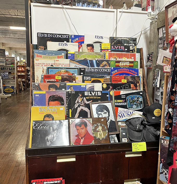 The King reigns supreme in this corner of Tupelo. Elvis album covers create a timeline of pompadours, jumpsuits, and American musical evolution.