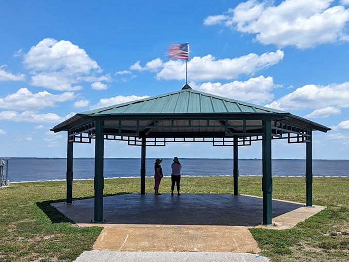The lakeside gazebo offers shade and panoramic views&mdash;perfect for those "I need a moment" escapes from Florida's relentless sun.