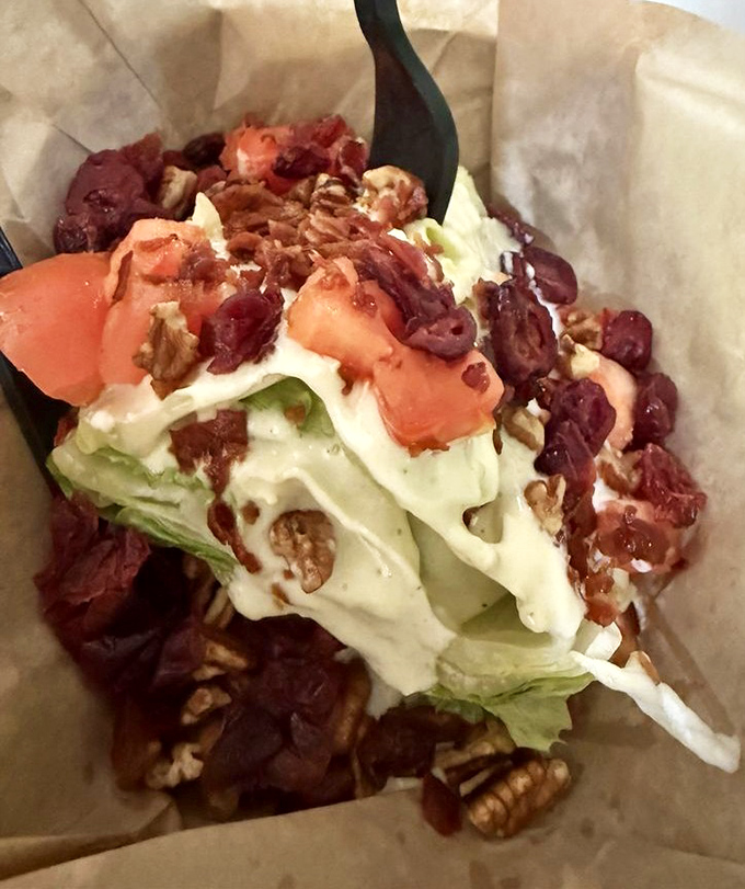 This wedge salad might be the only green thing you'll eat today, but with bacon bits and blue cheese, it's hardly taking the moral high ground on nutrition.