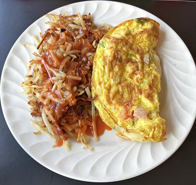 This Western omelet is folded like a love letter to breakfast, with hash browns so perfectly crisped they deserve their own fan club.