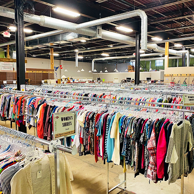 Women's clothing sections spanning multiple racks prove one person's closet purge is another's wardrobe jackpot waiting to happen.