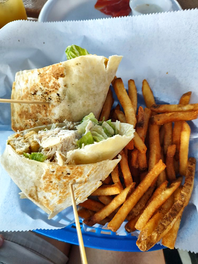 A wrap that actually stays wrapped! Paired with fries that look hand-cut because they probably are. Simple food done right is culinary poetry.
