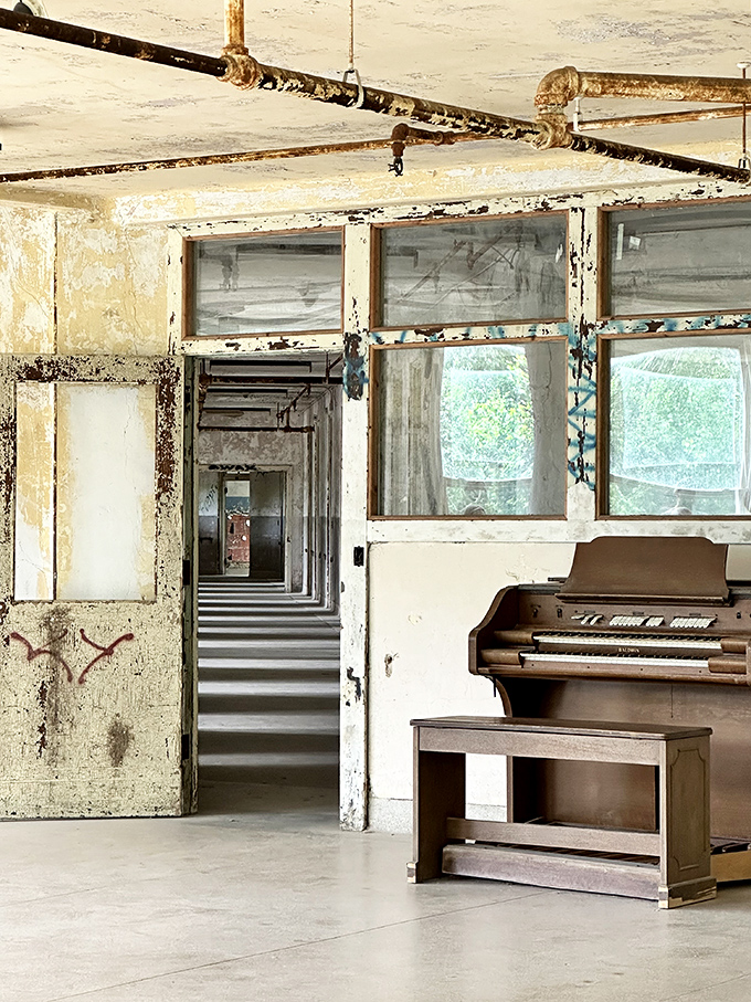 Music abandoned mid-melody. This weathered piano hasn't played a tune in decades, yet somehow you can almost hear its ghostly notes.