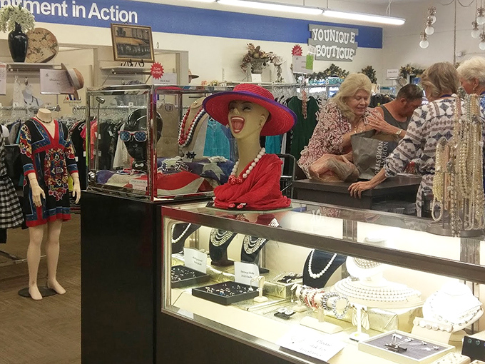 Jewelry display cases that would make Elizabeth Taylor do a double-take, complete with mannequin modeling the "I'm-feeling-fancy" red hat ensemble.