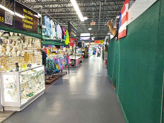 Jewelry cases and clothing racks create canyons of commerce where "just browsing" becomes "just buying" faster than you can say "what a deal!"