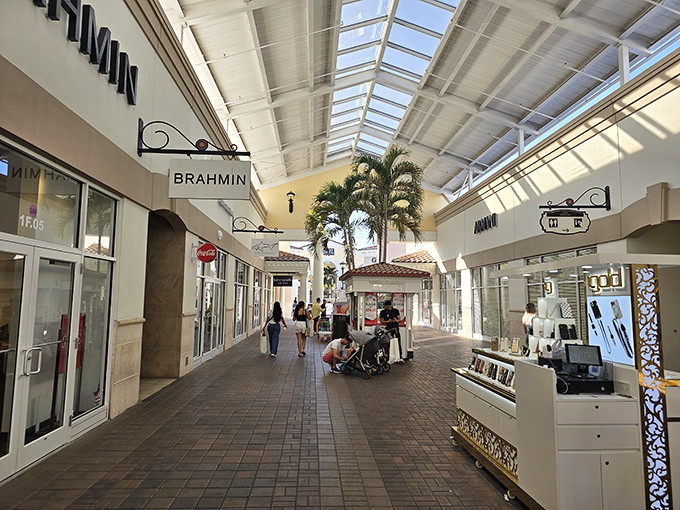 Sunlight streams through skylights in this upscale section, where brands like Brahmin tempt shoppers with leather goods that whisper "treat yourself" in very persuasive tones.