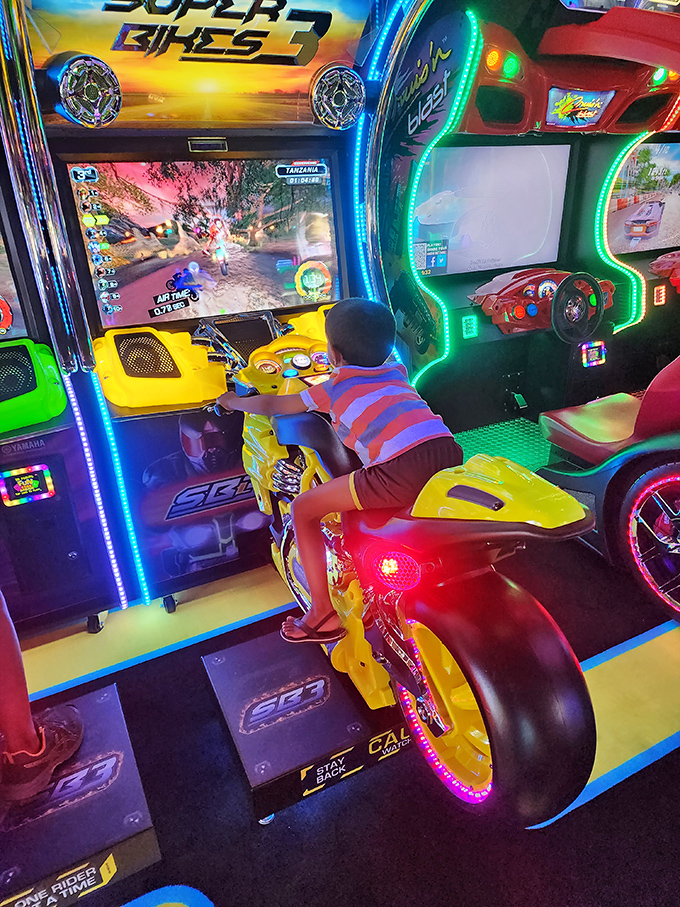 Future racing champion in training! The arcade area offers welcome entertainment for young shoppers who've reached their clothing-rack tolerance threshold.