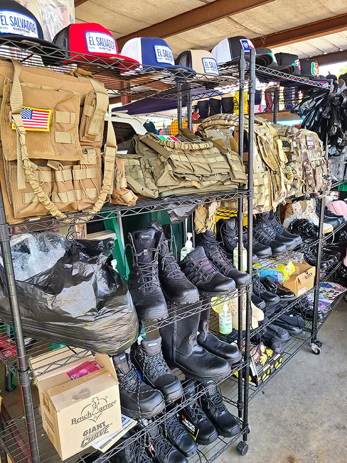 Tactical gear meets everyday footwear in this carefully organized display. From combat boots to baseball caps, this vendor's got you covered&mdash;literally.