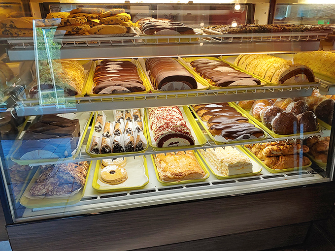 The dessert case—where willpower goes to die and "I'll just have coffee" turns into "and a slice of that... and that... and maybe that."