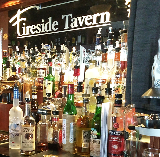 The bar area glows with amber bottles like a treasure chest for adults. A selection that would make even the most discerning spirits enthusiast nod in approval.