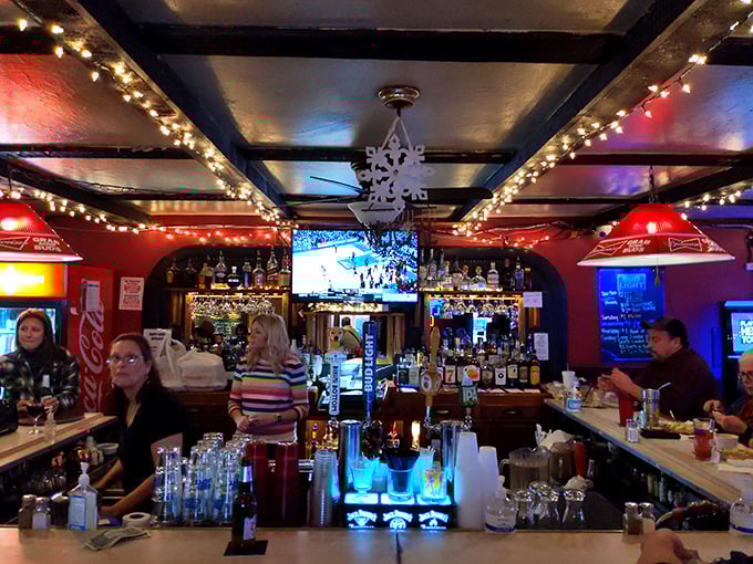 The bar where everybody might not know your name yet, but they will by your second visit. Those red pendant lights set the perfect mood.
