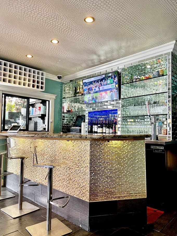 The bar gleams with possibility&mdash;mirrored tiles reflecting glasses waiting to be filled with something wonderful. Modern elegance meets casual Venice Beach vibes.