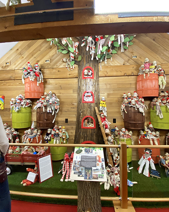 The sock monkey family tree comes to life in this imaginative display. Each barrel cradles its own tribe of grinning, dangling primates.