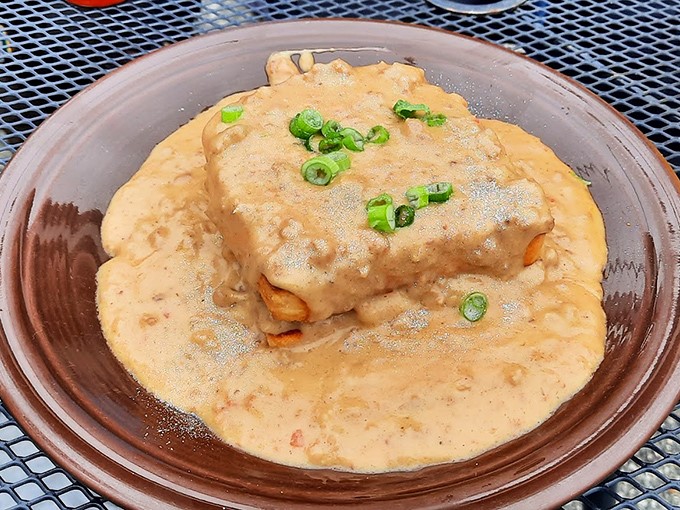 Biscuits drowning happily in gravy, like a spa treatment for your taste buds. The green onions are just showing off at this point.