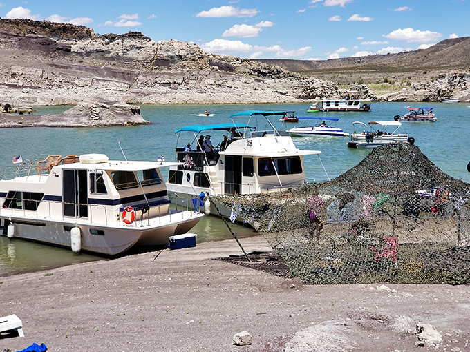 Floating neighborhoods form temporary communities on Elephant Butte's waters. These houseboats prove that some of the best real estate doesn't require a foundation. 