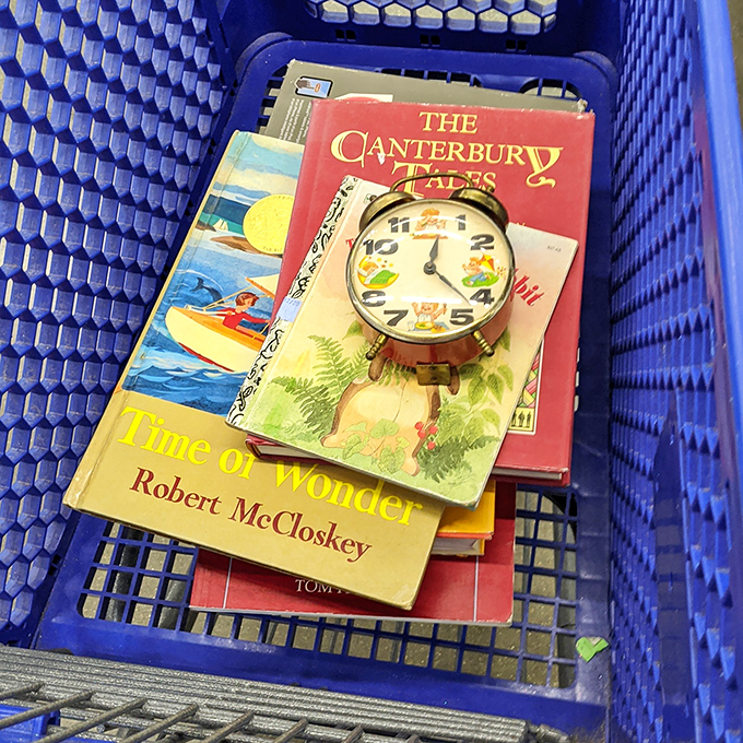 Literary treasures and a charming clock nestled in a blue basket. Time stands still when you're lost in Canterbury Tales or Robert McCloskey's gentle storytelling.