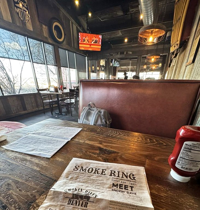 The booth where barbecue dreams come true, with rustic wood tables that have likely witnessed countless "first bite" expressions of pure joy.