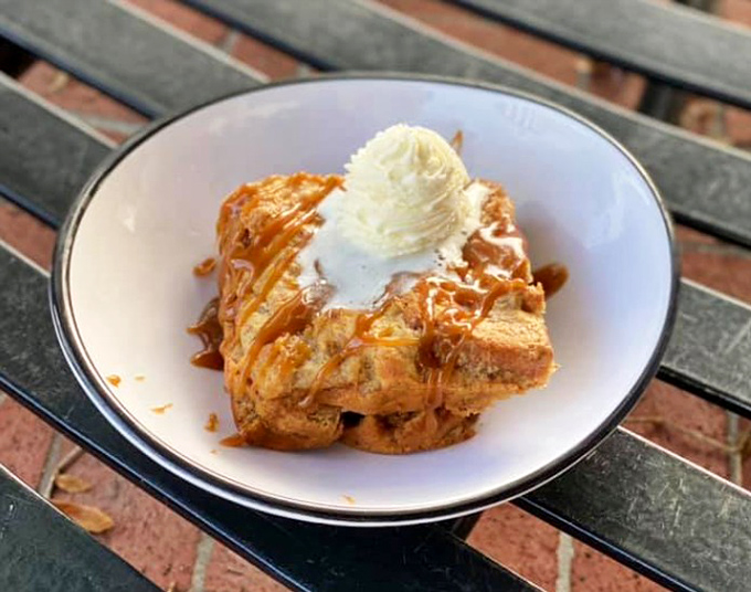 Bread pudding drizzled with caramel sauce and topped with ice cream&mdash;comfort food that hugs your soul from the inside.