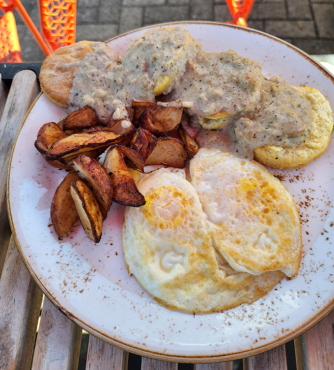 Breakfast of champions! Perfectly cooked eggs, crispy potatoes, and biscuits and gravy that could settle family feuds.