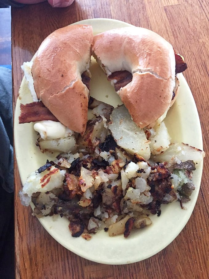 A breakfast sandwich that understands the assignment&mdash;golden bagel, melty cheese, and home fries that make fast-food versions hang their head in shame.