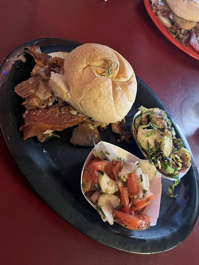 A sandwich that requires both hands and several napkins. Those fresh veggie sides provide the illusion of healthfulness.