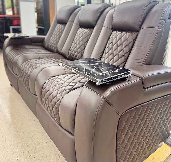 This quilted leather recliner sofa screams luxury louder than its price tag whispers, making your living room makeover dreams suddenly very achievable.