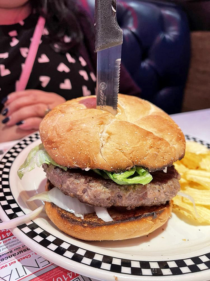 This isn't just a burger&mdash;it's a towering monument to beef that requires both hands, several napkins, and absolutely no distractions.