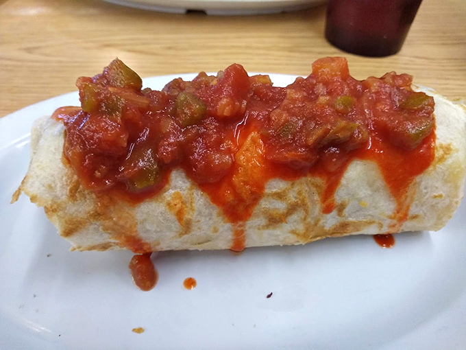 This breakfast burrito isn't messing around &ndash; it's bringing serious salsa game to the morning table. Hangover cure? Quite possibly.