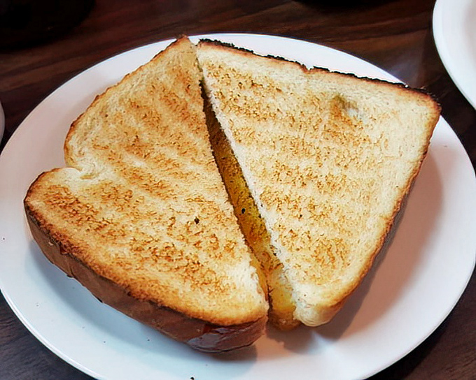 Toast so perfectly buttered and grilled it makes you wonder why you ever bothered with avocado or artisanal spreads in the first place.