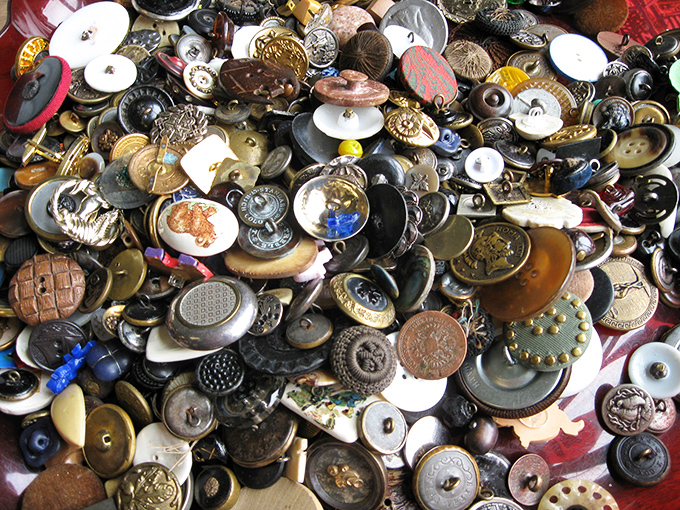 A sea of buttons that would make your grandmother swoon&mdash;each one a tiny work of art representing fashion history in miniature form.