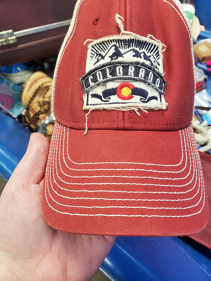 Someone's forgotten Colorado souvenir becomes another's perfect fishing hat—the circle of thrift life continues at $1.49 per pound.